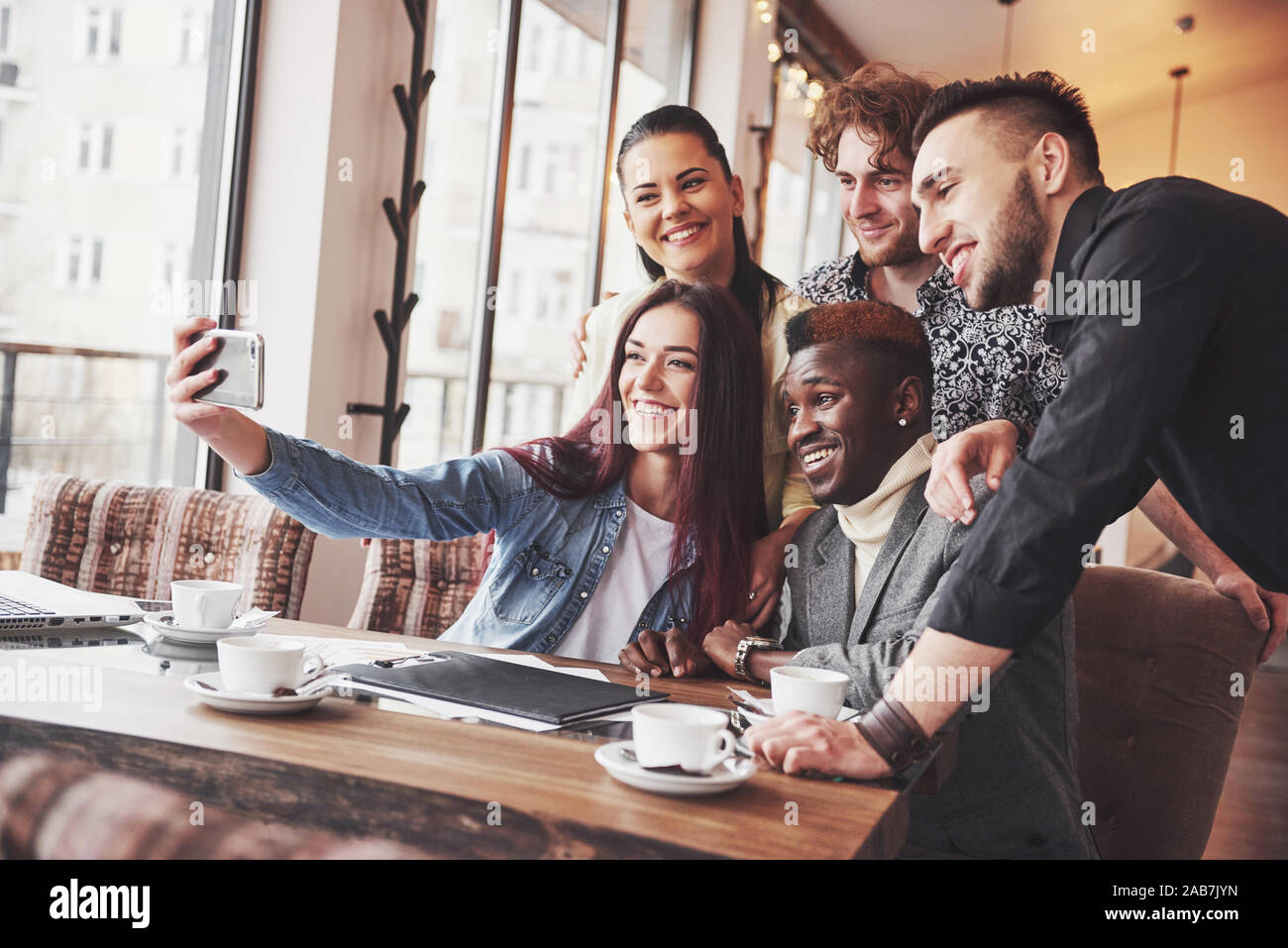 Selfie of young smiling people having fun together. Best friends taking ...