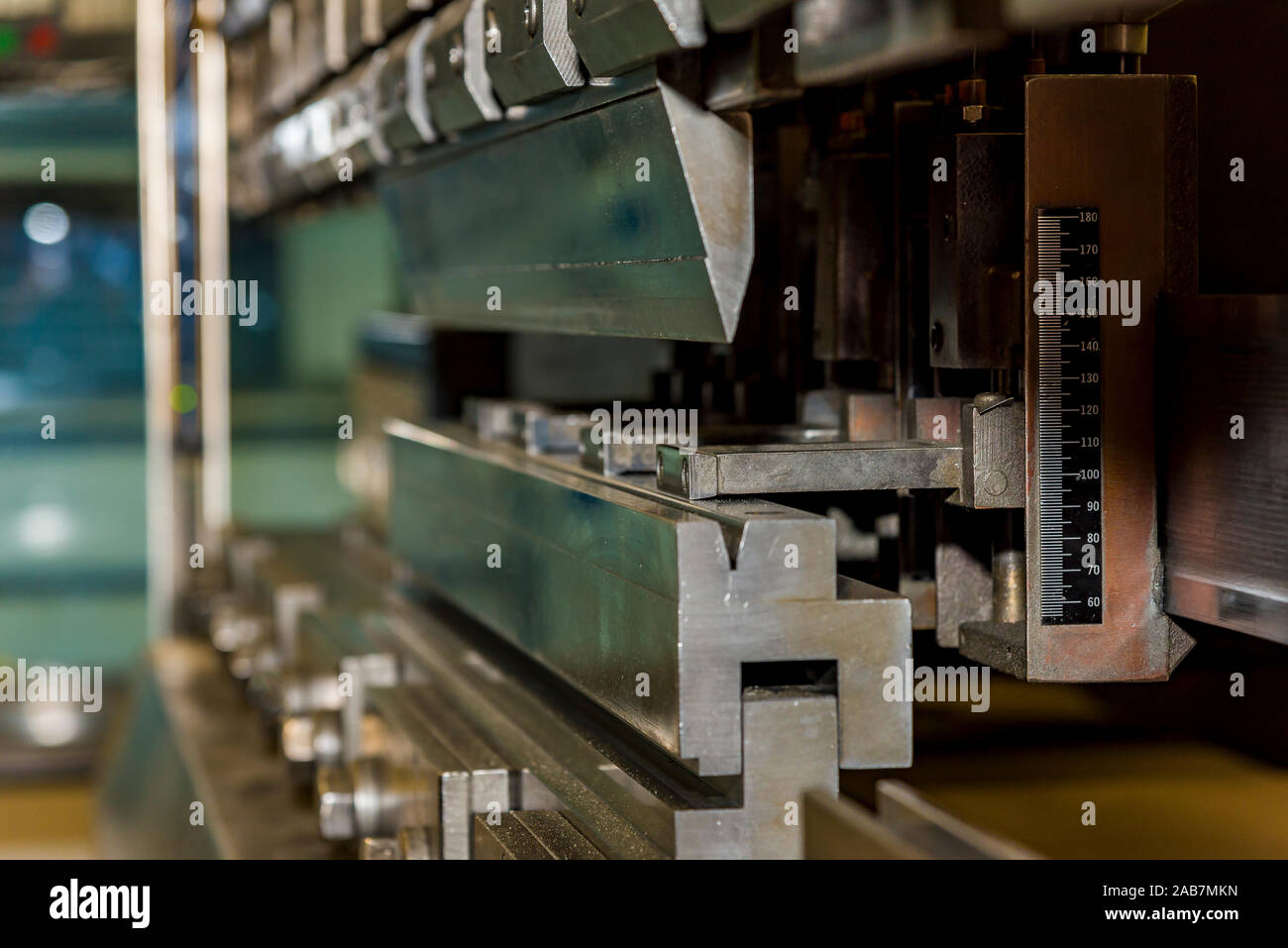 operator bending metal sheet by sheet bending machine bending of metal ...