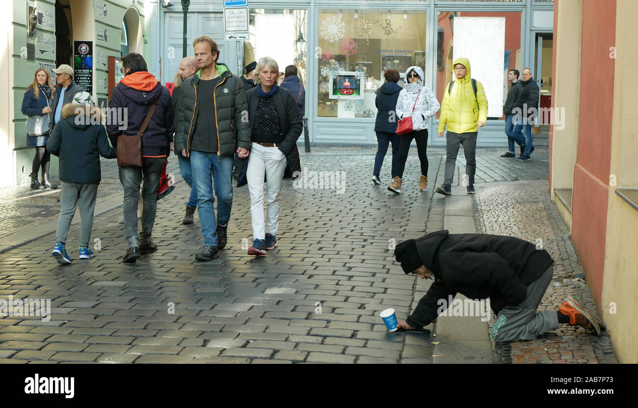 Homeless begging tourists throw coin money into cup and recalculates ...