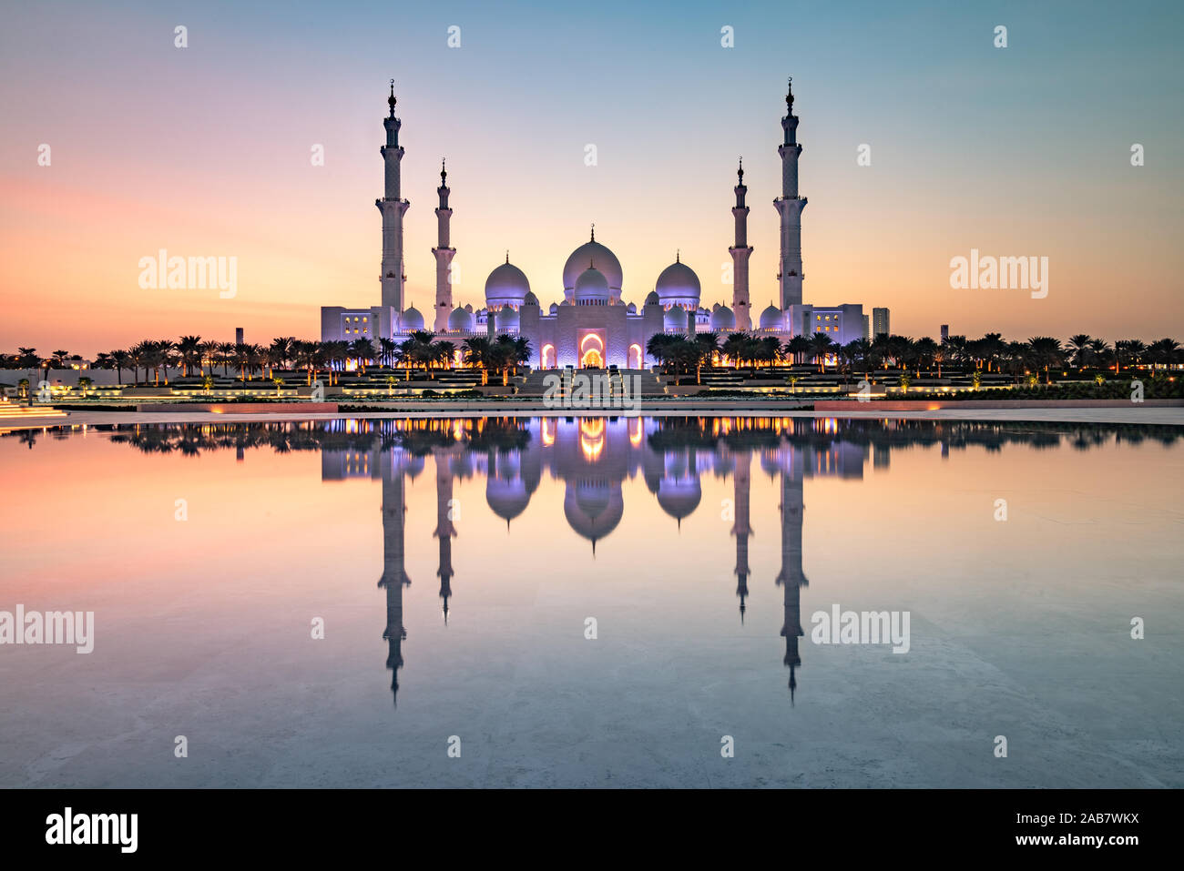 Abu Dhabi's magnificent Grand Mosque viewed in a reflecting pool, Abu ...