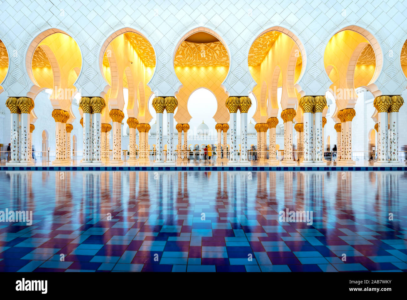 Abu Dhabi's magnificent Grand Mosque lit up during the evening blue ...