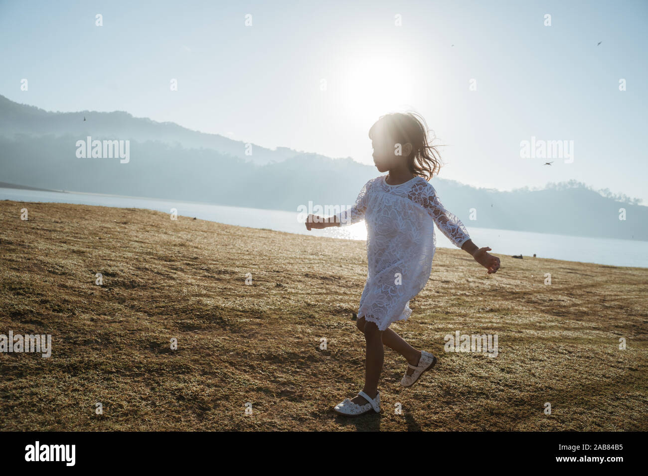asian kid playing an outdoor Stock Photo - Alamy