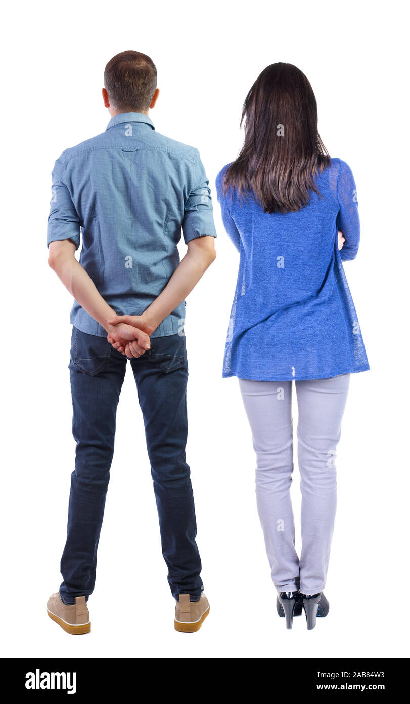 Back view of couple. beautiful friendly girl and guy together. Rear ...