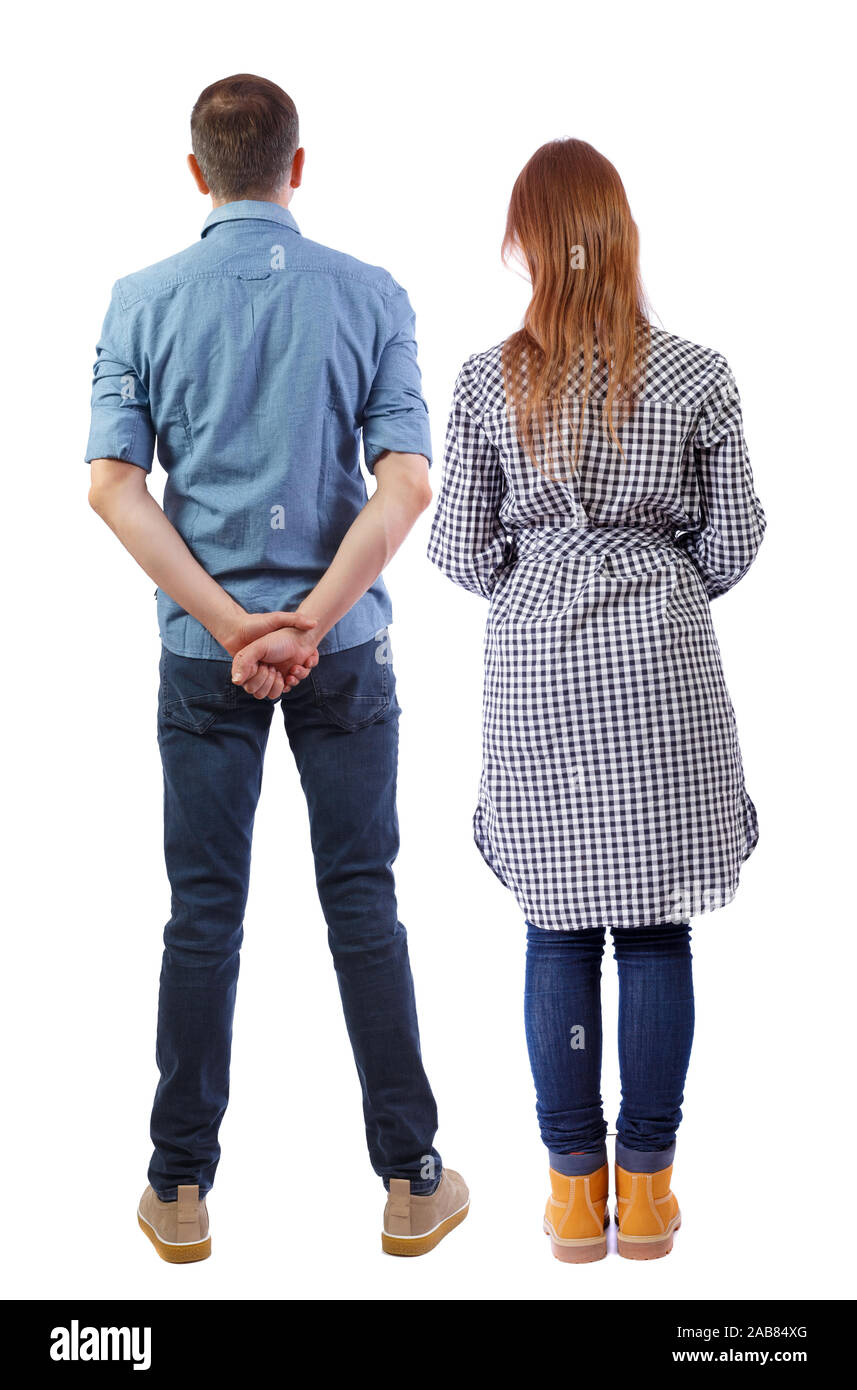 Back view of couple. beautiful friendly girl and guy together. Rear ...