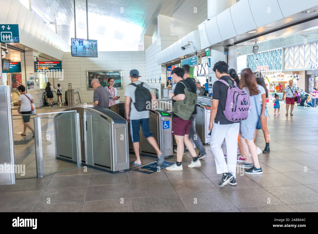 Asia/Singapore - Nov 22, 2019 : Passengers entering and exiting gantry ...