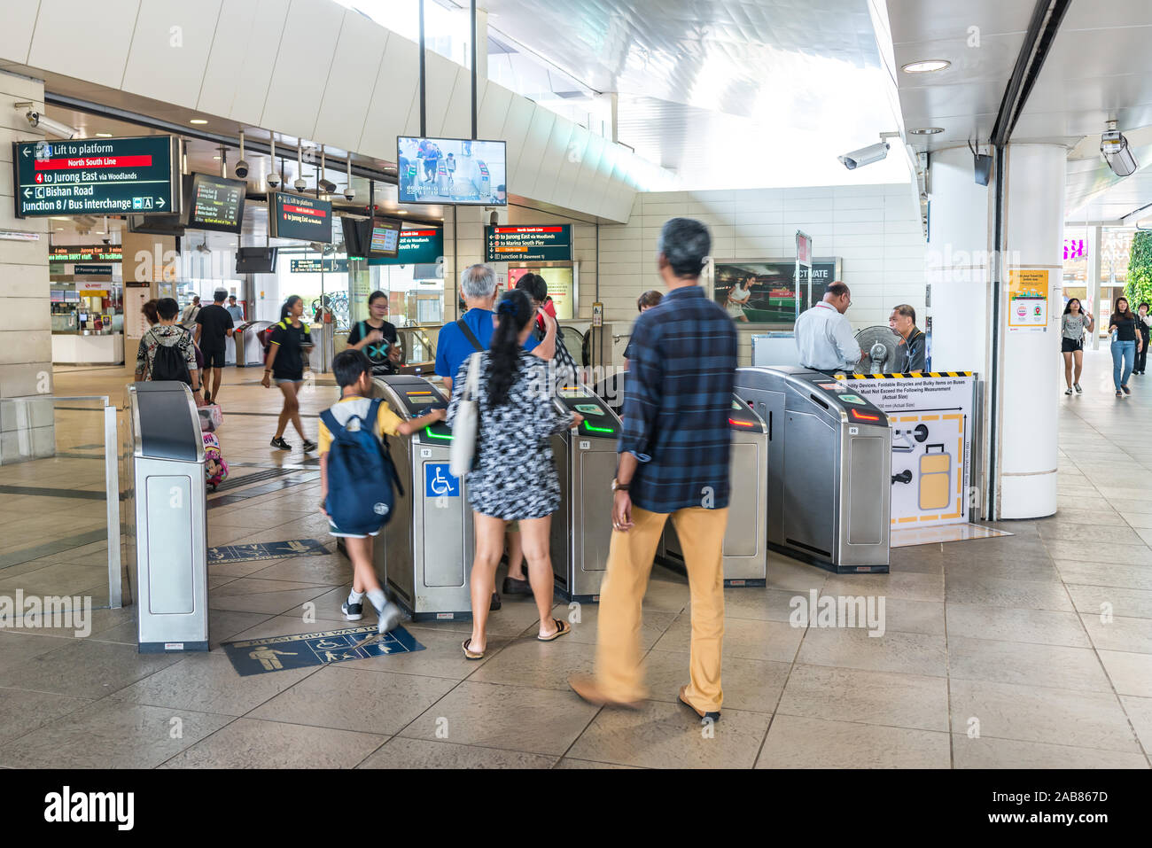 Asia/Singapore - Nov 22, 2019 : Passengers entering and exiting gantry ...