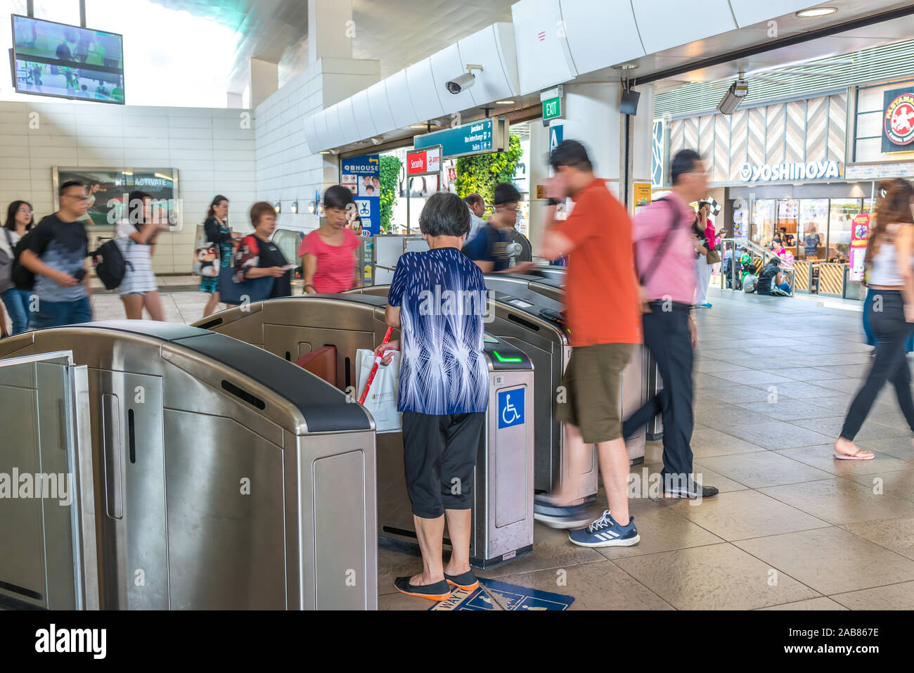 Asia/Singapore - Nov 22, 2019 : Passengers entering and exiting gantry ...