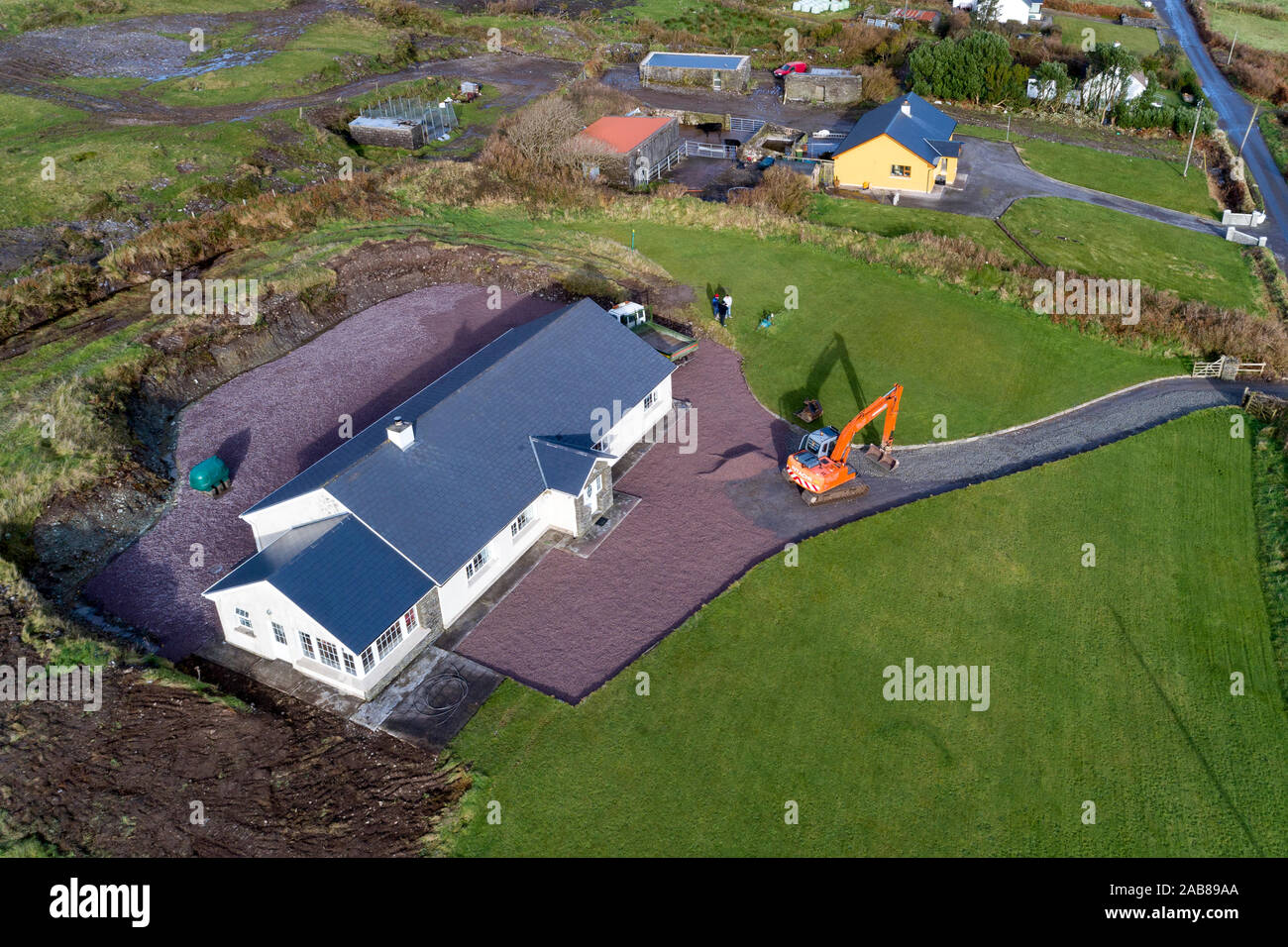 Laying gravel on a driveway at Irish house, County Kerry, Ireland Stock ...