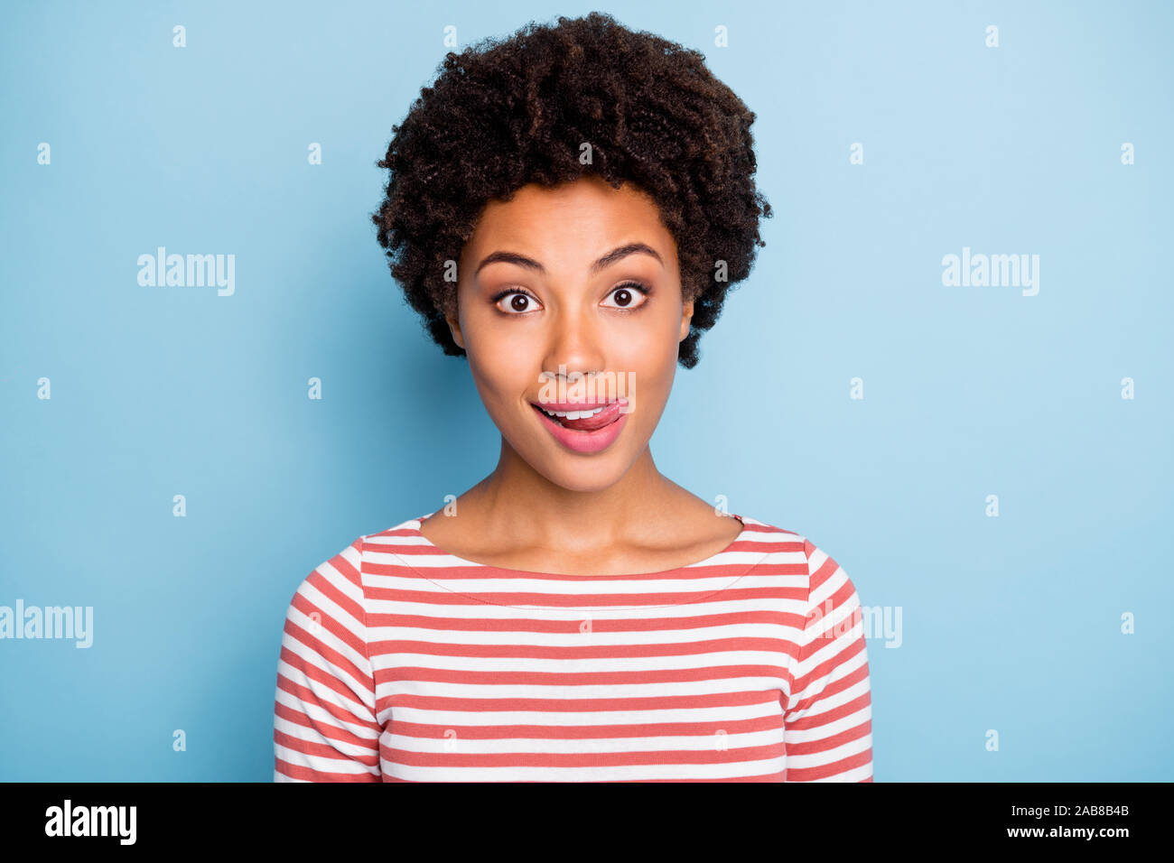 Closeup photo of amazing dark skin lady coquettish mood licking upper ...