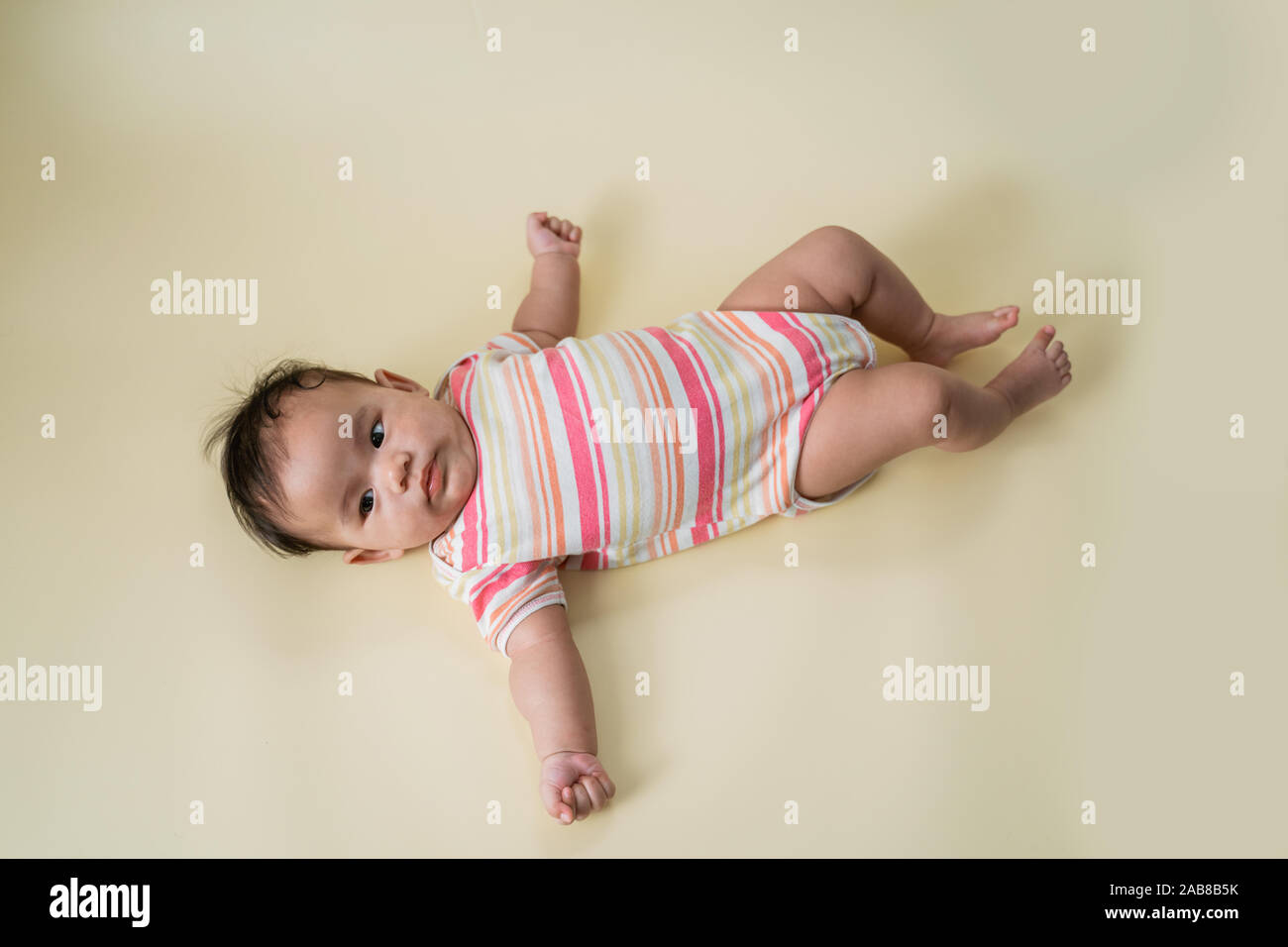laying time cute baby in studio Stock Photo - Alamy