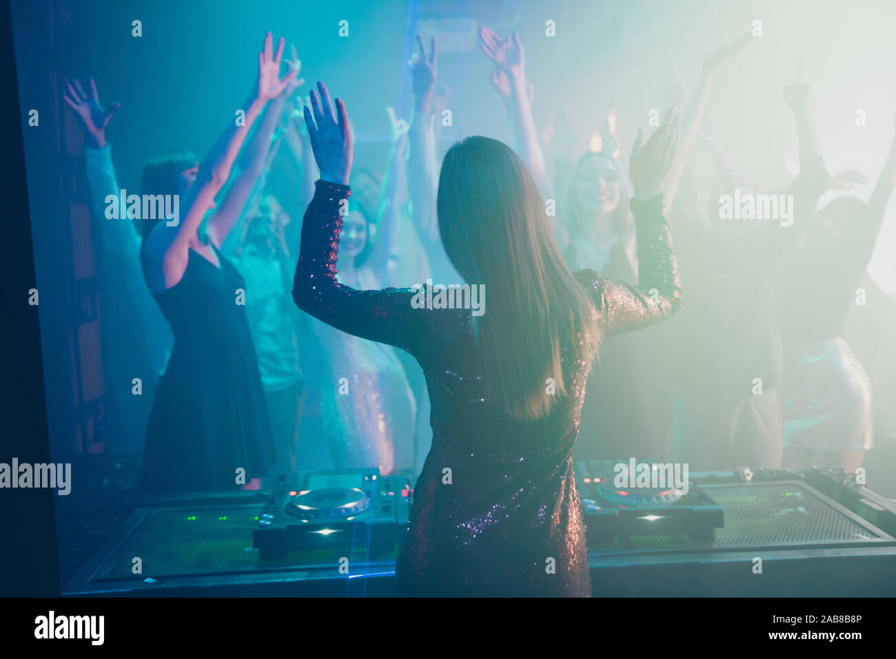 Rear back behind view of dj mc pj performing stereo sound rhythm trance ...