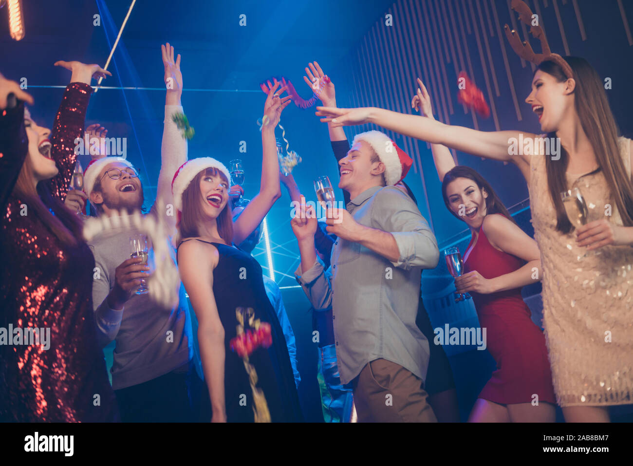 Photo of corporate party company crowd raising hands up overjoyed x-mas ...