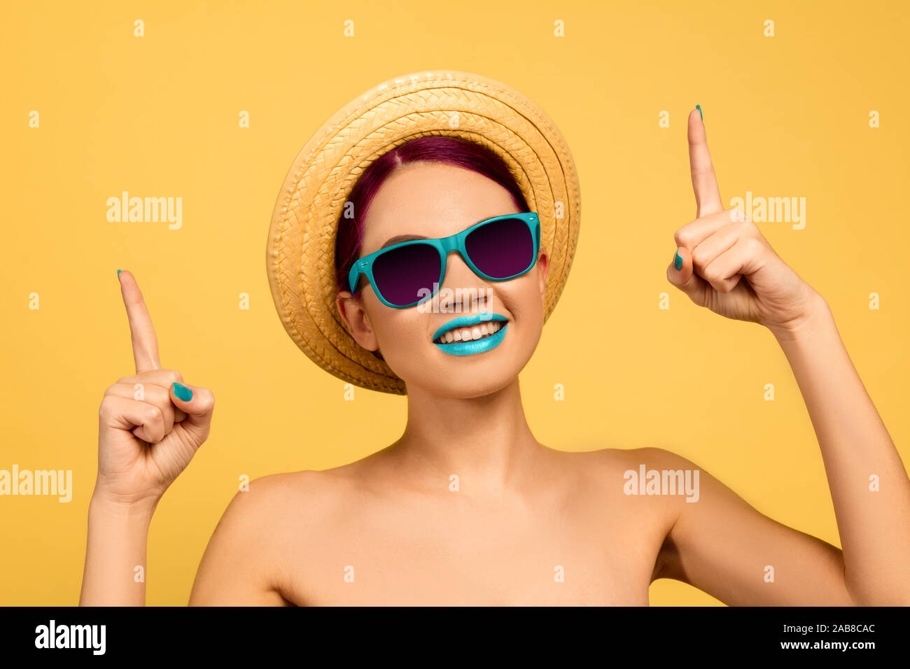 Portrait of beautiful woman with bright make-up, hat and sunglasses on ...