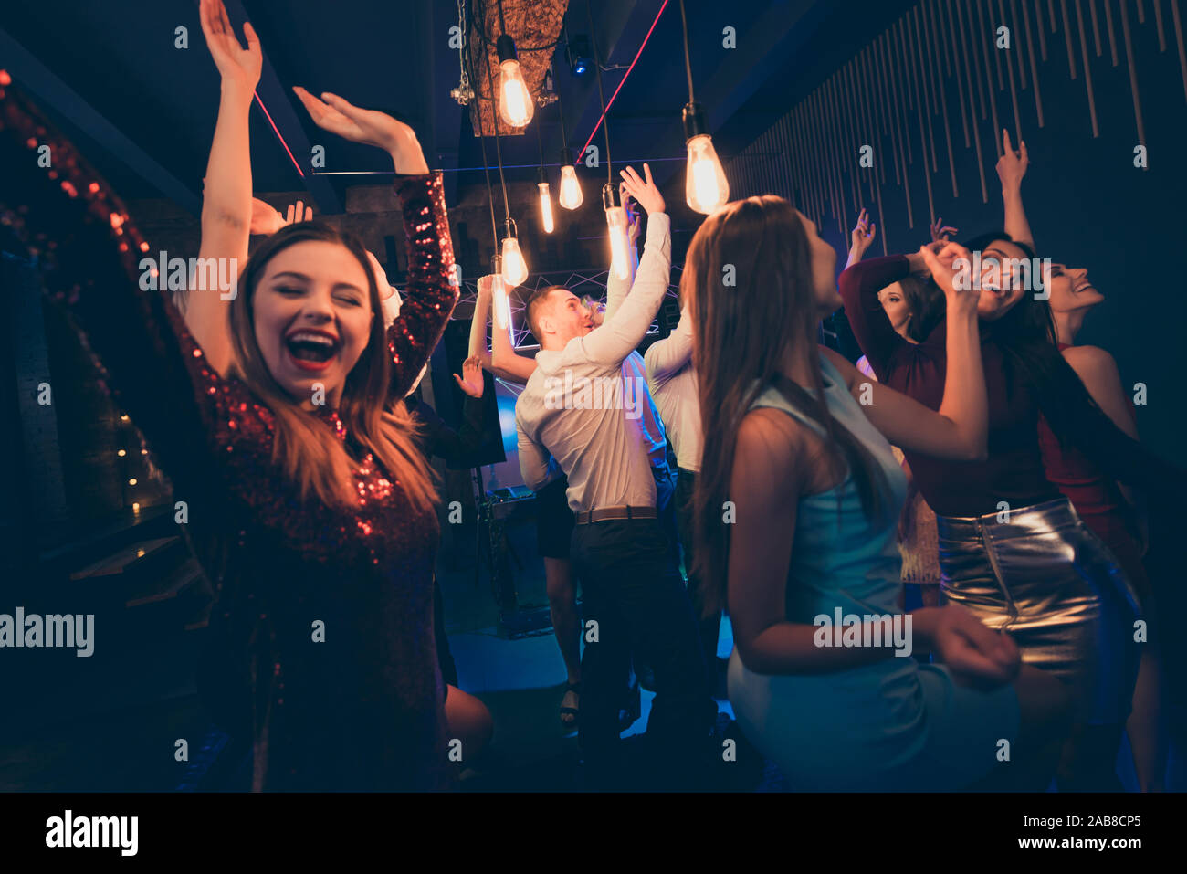 Portrait of cheerful positive people have fun on party celebrating ...