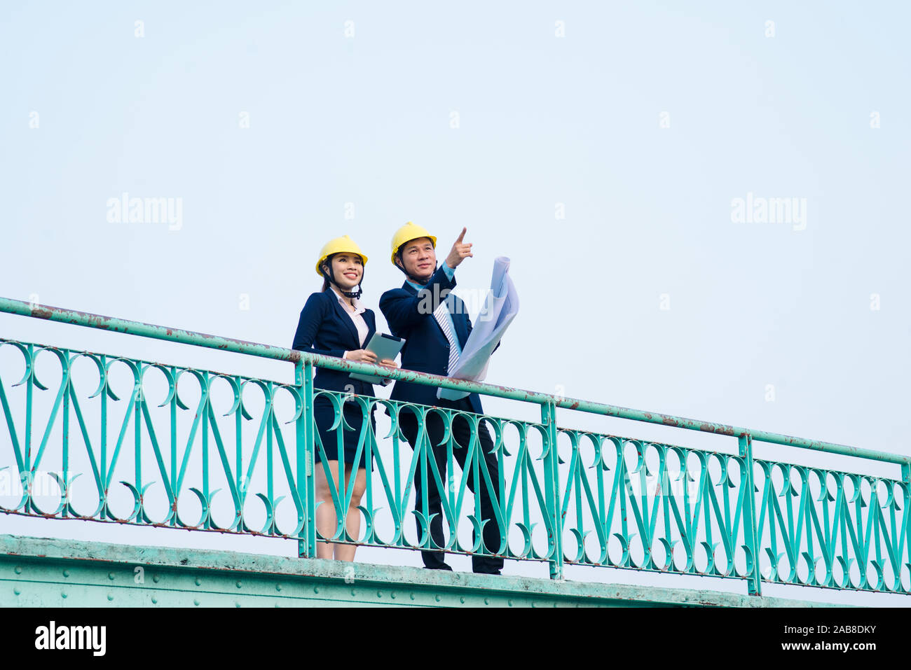 Asian engineer was acting with his secretary on the Business building ...