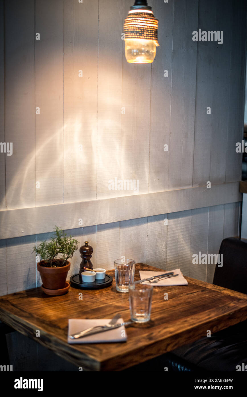 rustic country style restaurant with white walls, table seating and ...