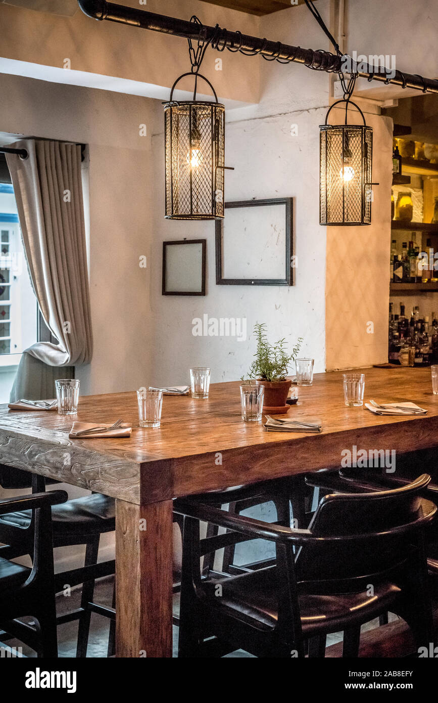 rustic country style restaurant with white walls, table seating and ...