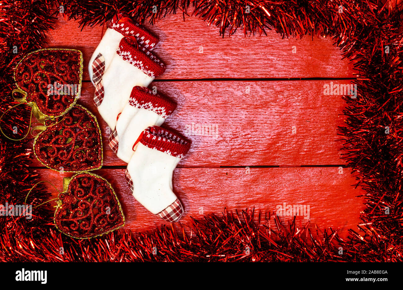 Christmas composition on red wooden board with Christmas garland and ...