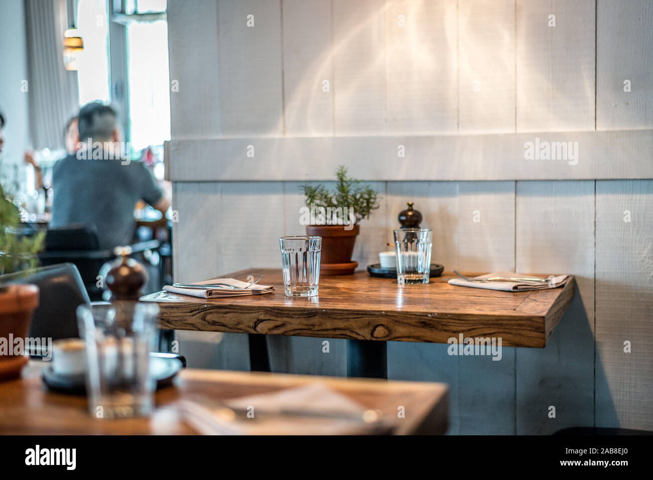 rustic country style restaurant with white walls, table seating and ...