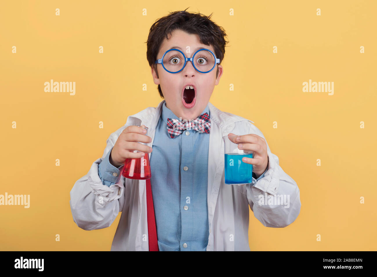 child scientist in laboratory on yellow background Stock Photo - Alamy