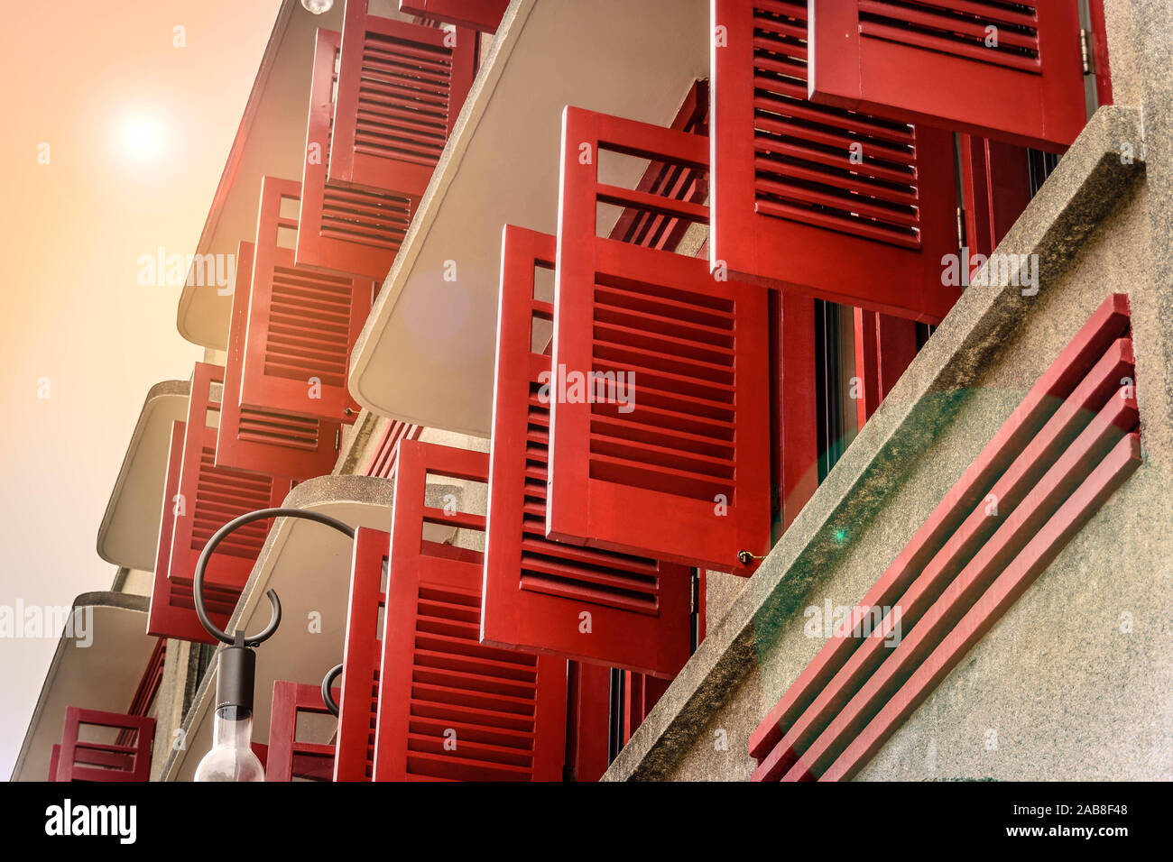 shophouse facade with red window shutters in Little India in Singapore ...