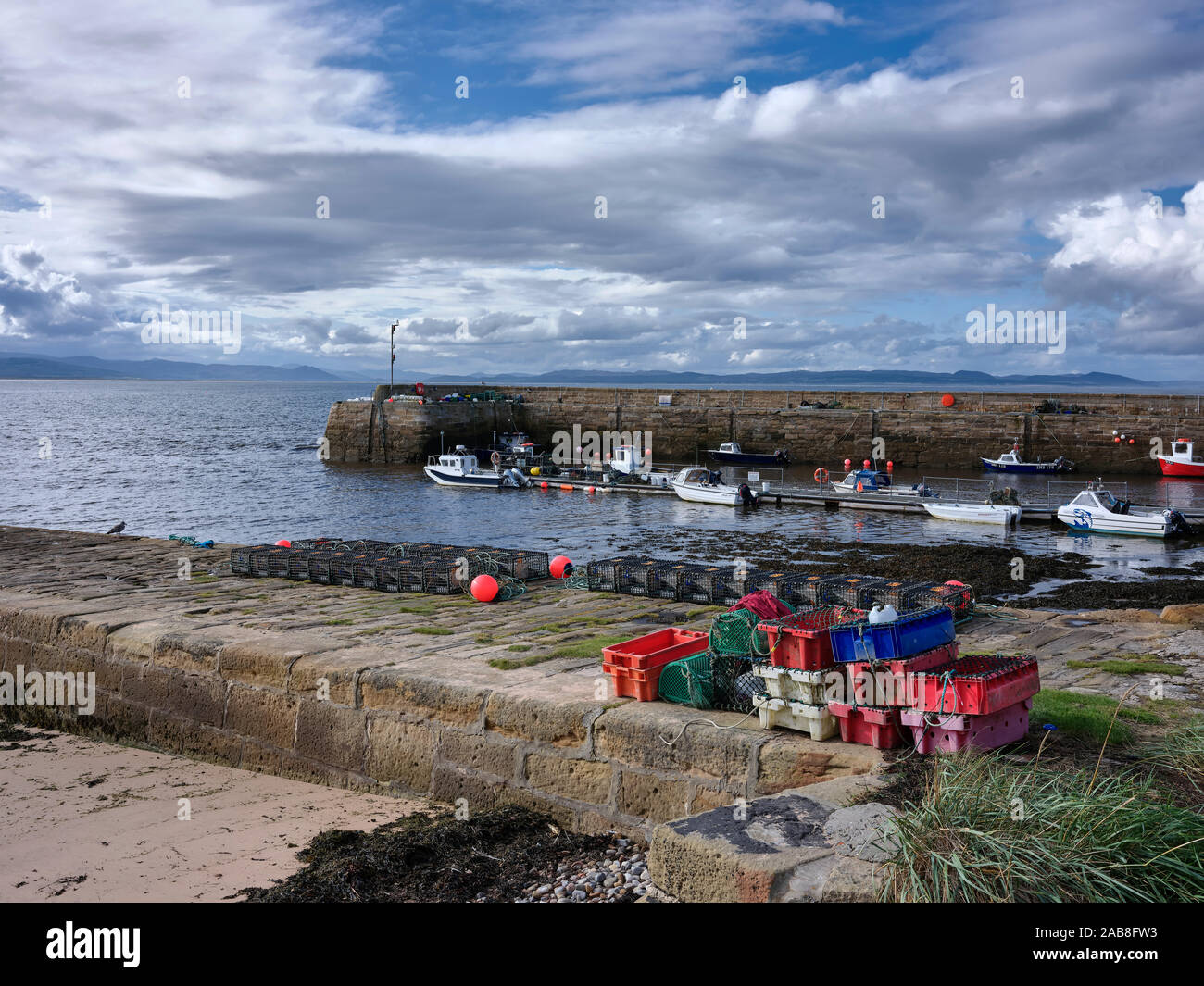 Low tide and the Thomas Telford harbour at Portmahomack with Lobster ...