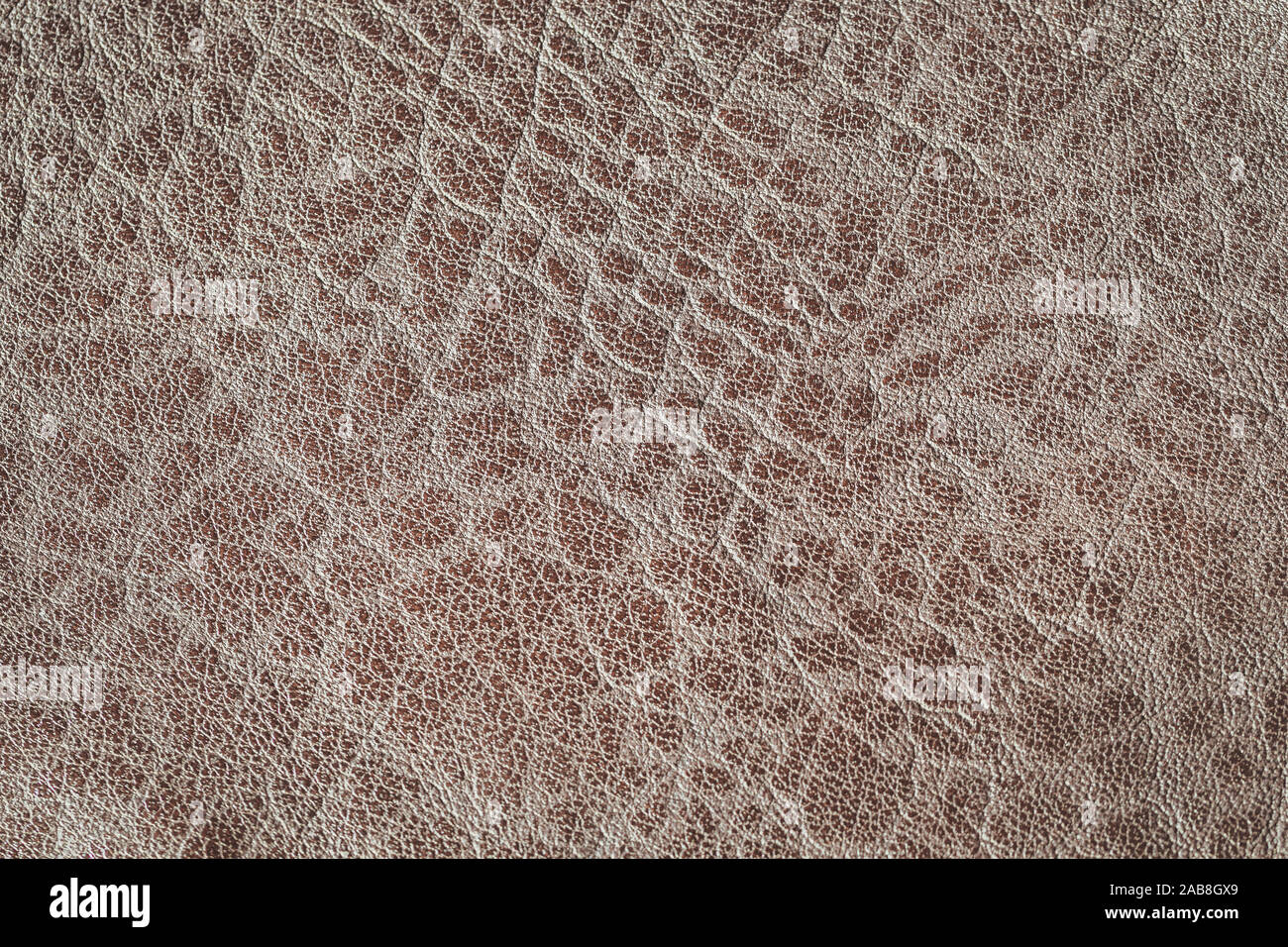 Genuine grainy leather texture closeup, brown color, matte surface ...