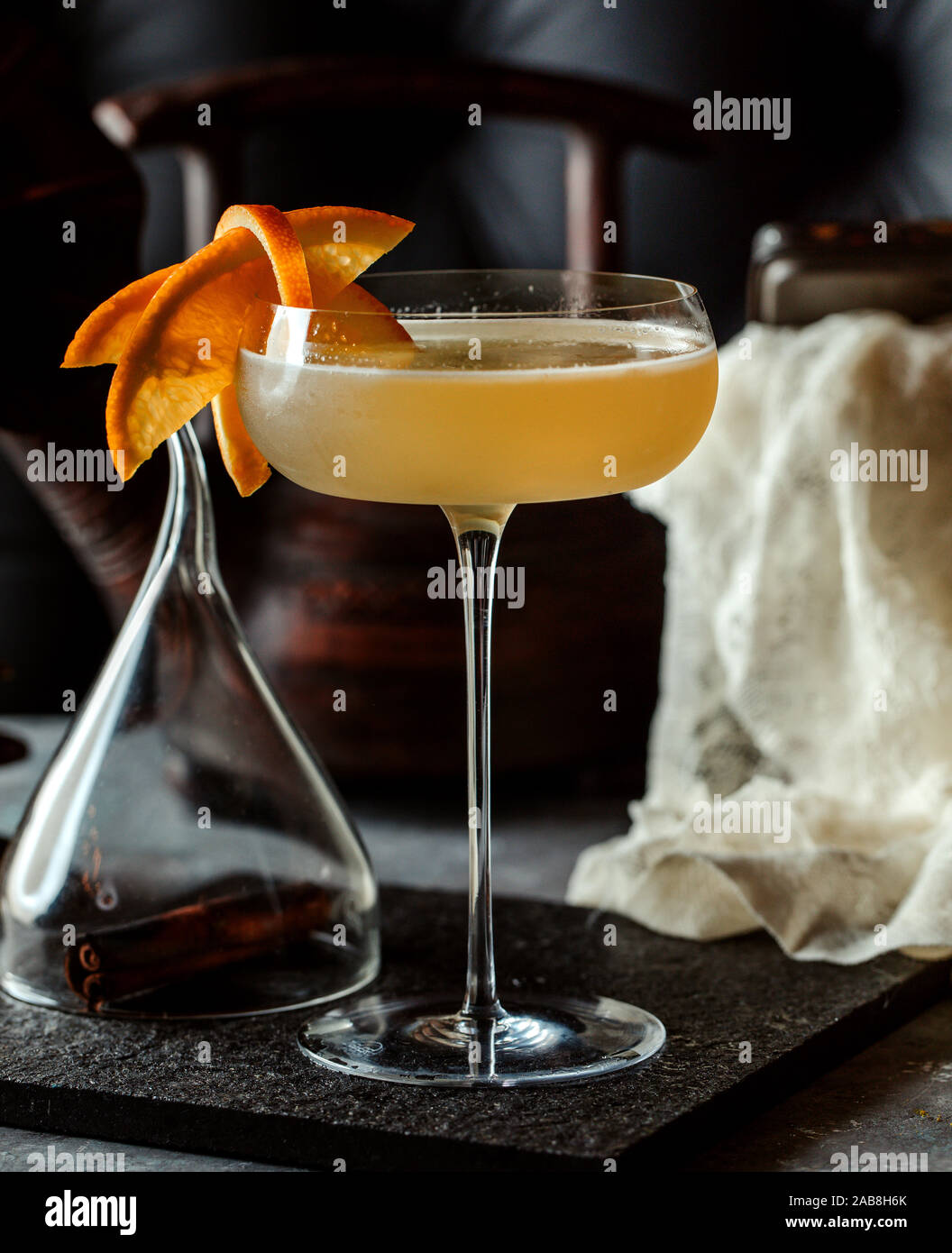 glass of cocktail garnished with orange slices in long stem glass Stock ...