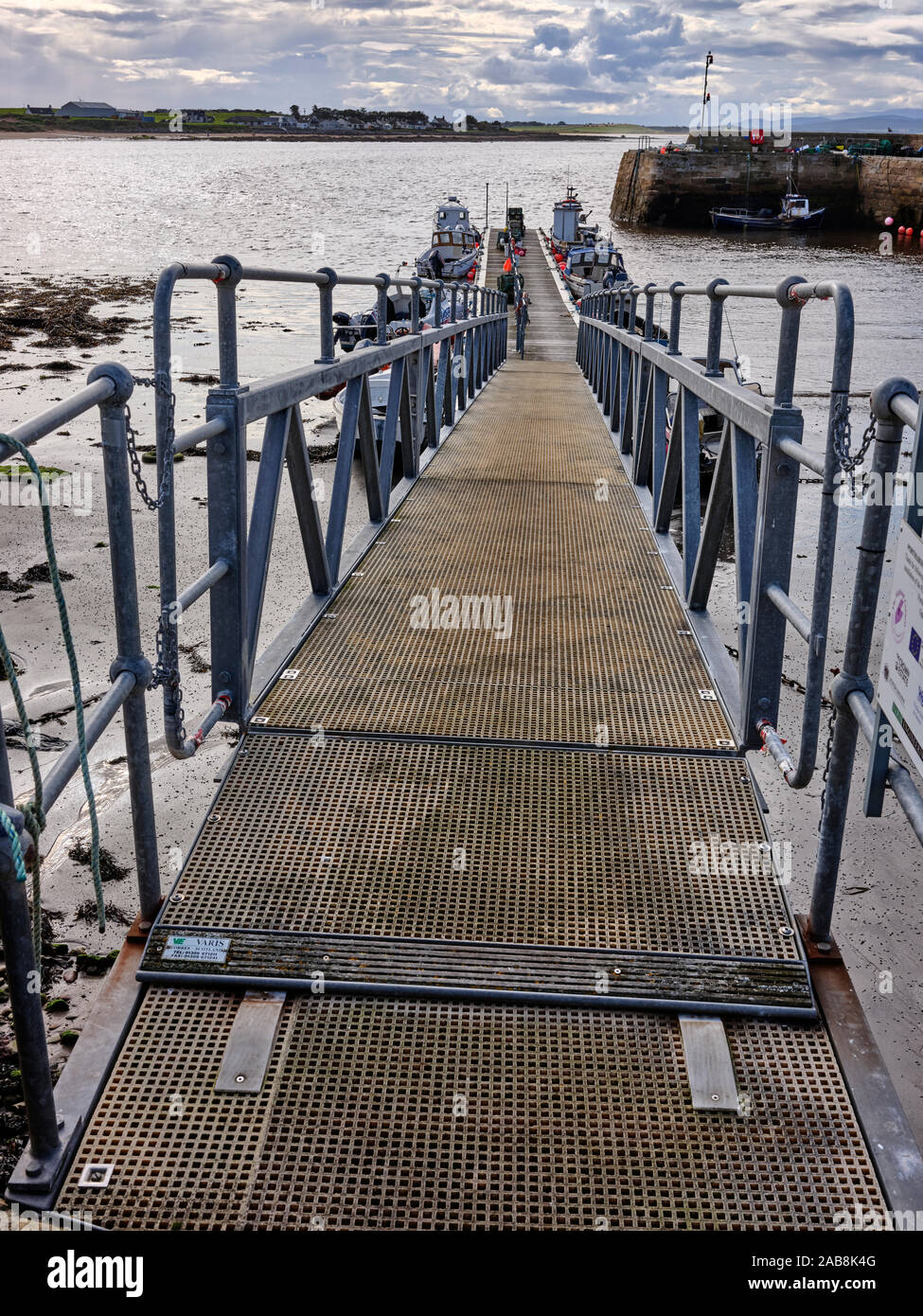 Low tide and the pontoon reaches into the Thomas Telford harbour at ...