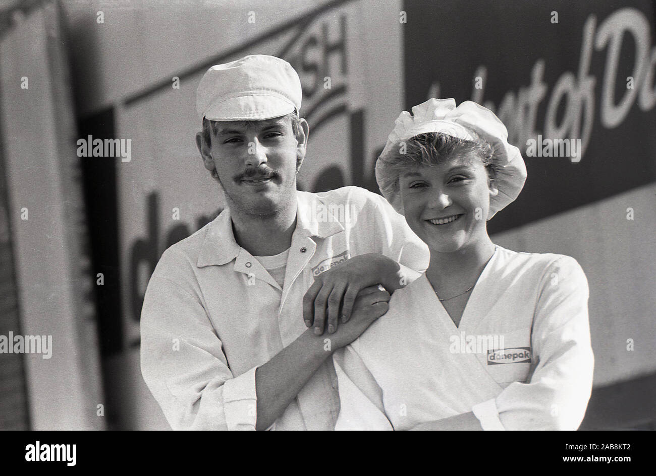 1987, historical, two young male and female workers at the Danepak ...