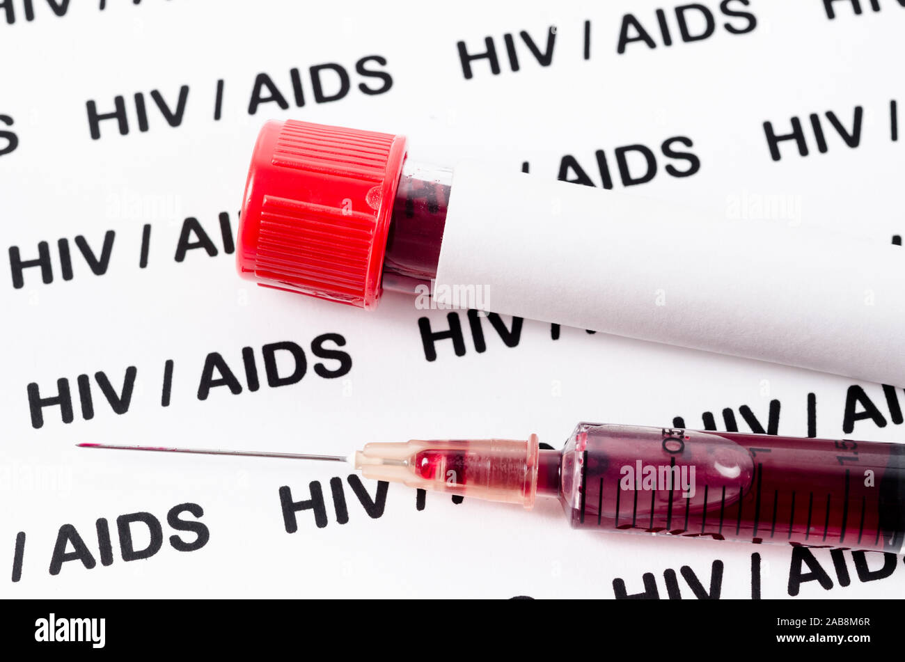 Sample blood for HIV test in syringe on HIV/AIDS background Stock Photo ...