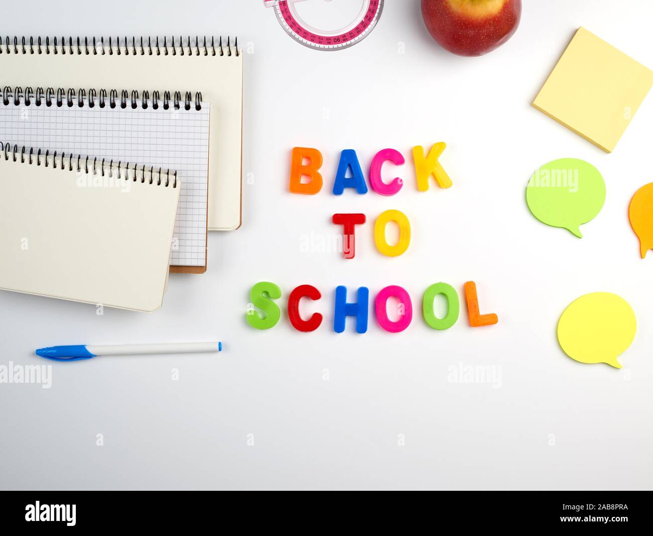 inscription back to school from multi-colored plastic letters and a ...