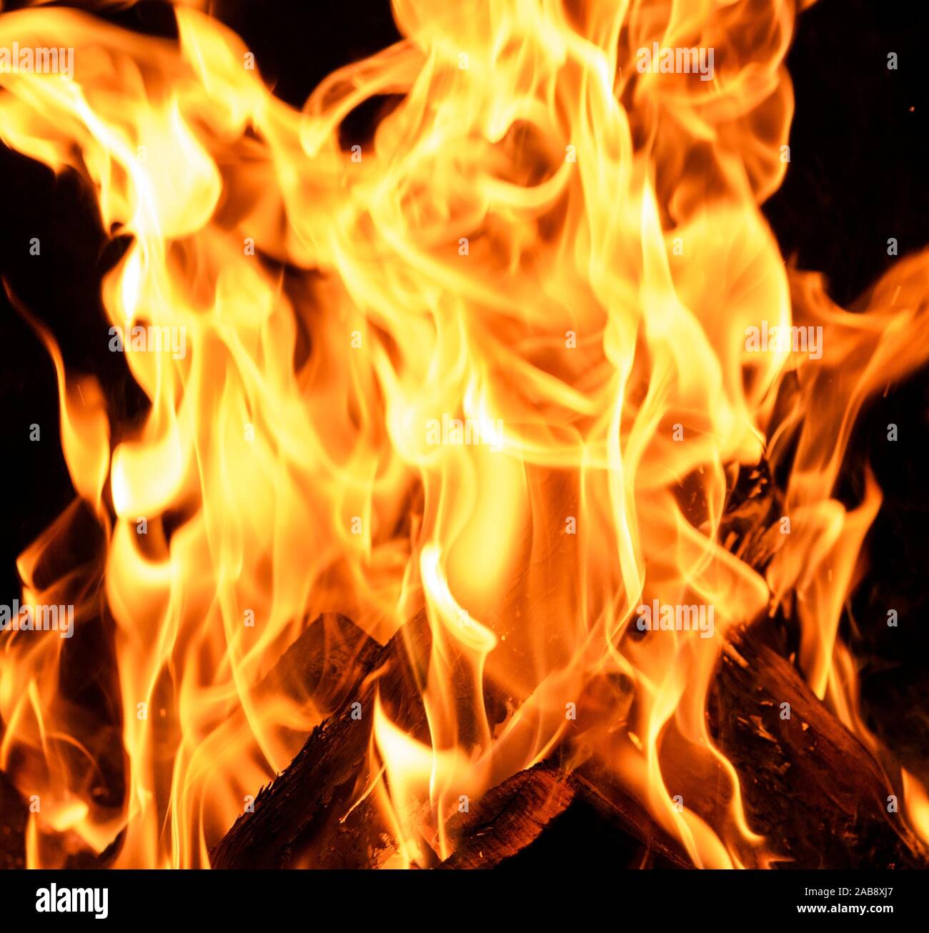bright orange and yellow flames on a black background,close up Stock ...