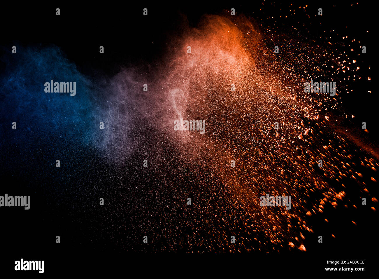 Orange blue powder explosion on black background.Orange blue color dust ...