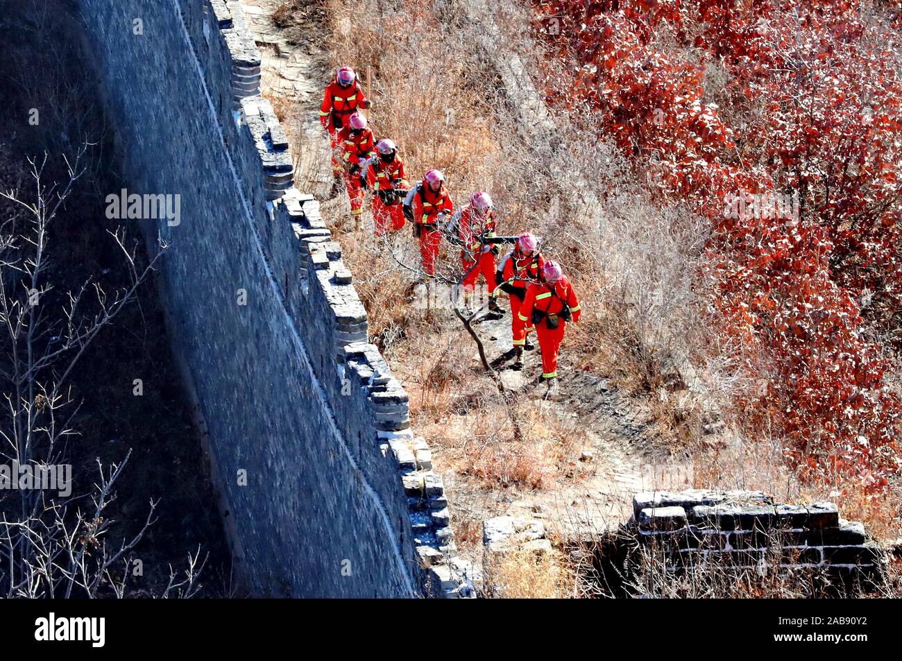 Chinese firefighters from the local forest firefighting brigade patrol ...