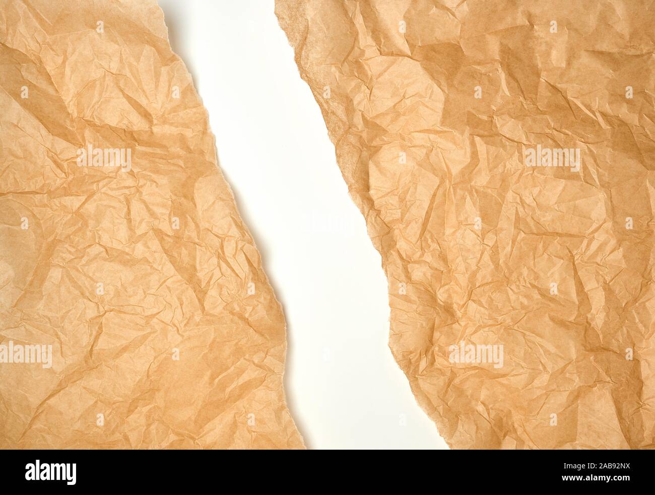 torn crumpled brown parchment paper, white background, close up Stock ...