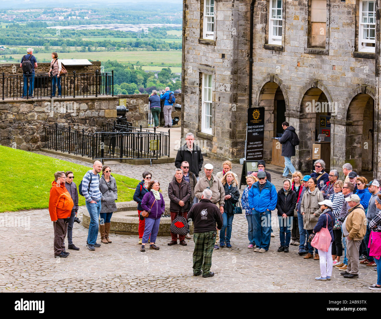 Guide wearing tartan trousers giving tour for tourists, Grand Battery ...
