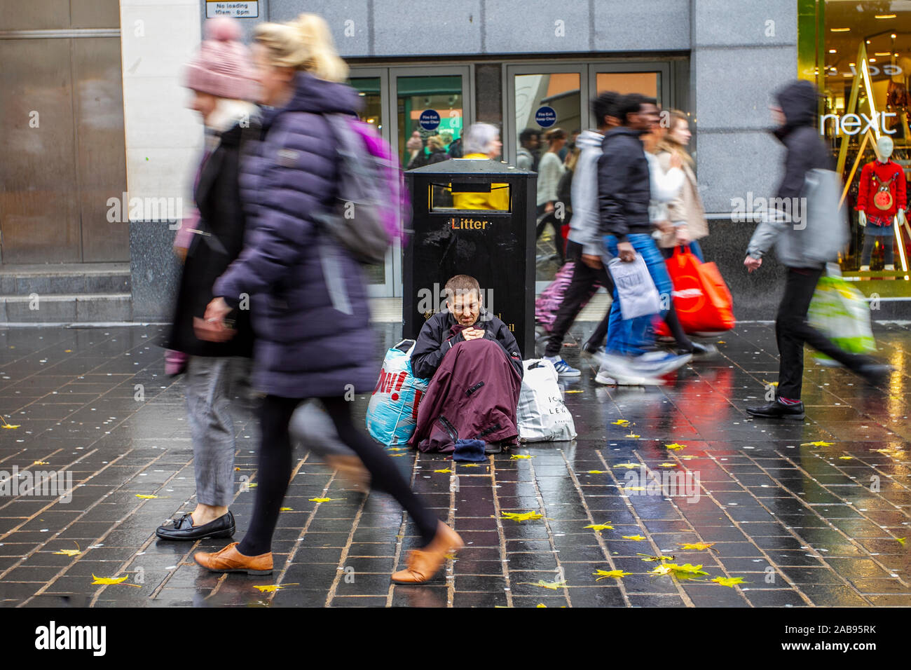 Liverpool, Merseyside, UK. 26th Noc, 2019 People passing beggar ...