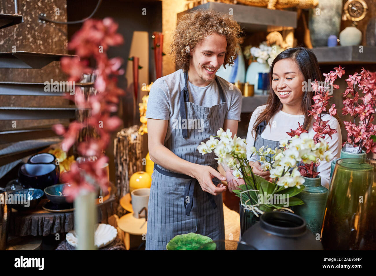 Florists in training work together in the flower shop Stock Photo - Alamy