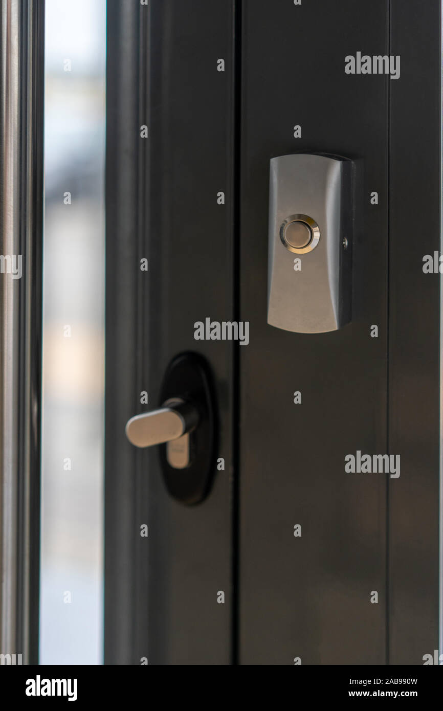 safety in residential buildings. metal door open button close up Stock ...