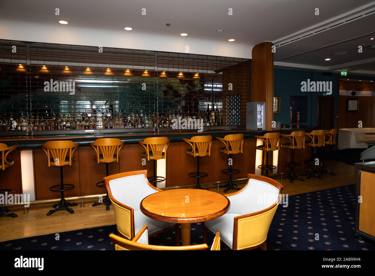 Golden Lion bar onboard Queen Elizabeth 2 docked in Dubai, UAE which is ...