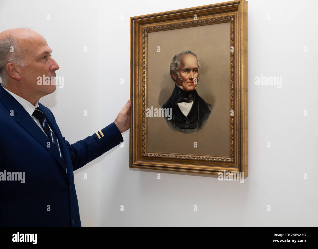 Tour manager Peter Warwick looks at a photo of Samuel Cunard, who ...