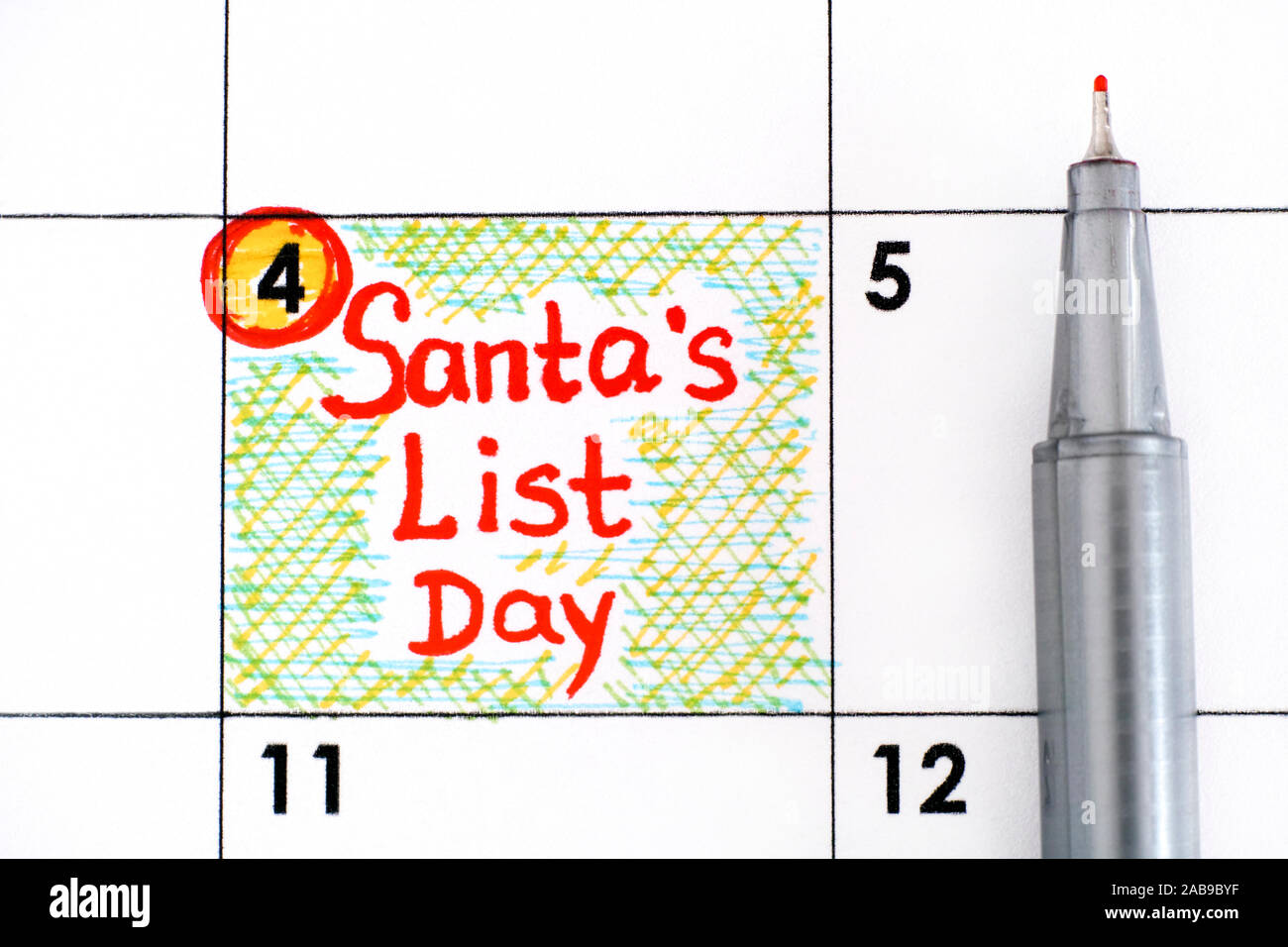 Reminder Santa’s List Day in calendar with pen. December 04 Stock Photo ...
