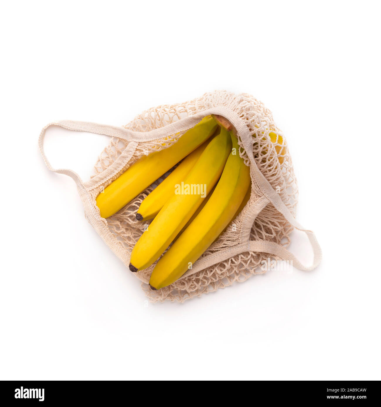 Organic bananas in eco string shopping bag isolated on white Stock ...