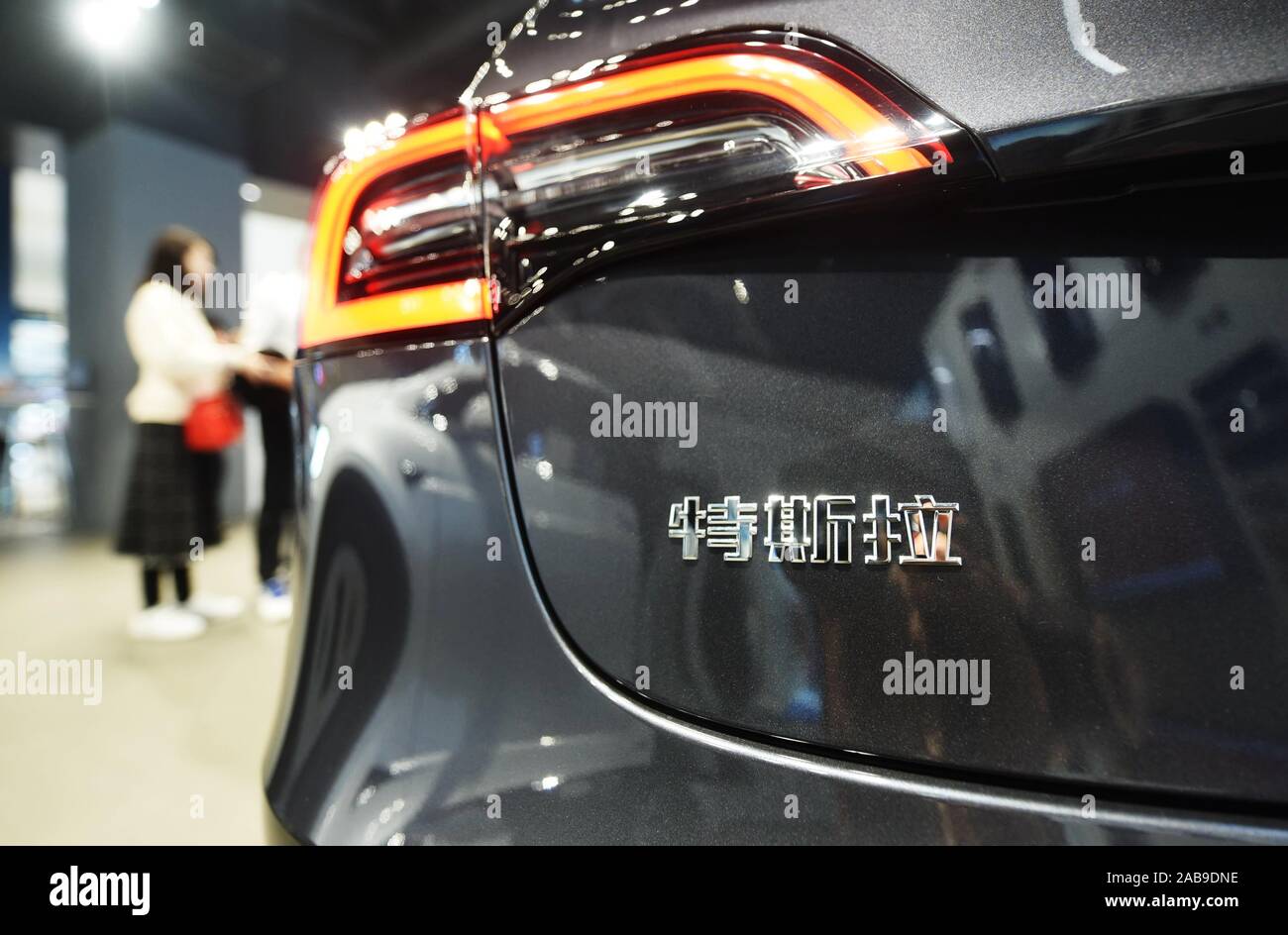 A Chinese-manufactured Tesla Model 3 electric car is on display at the ...