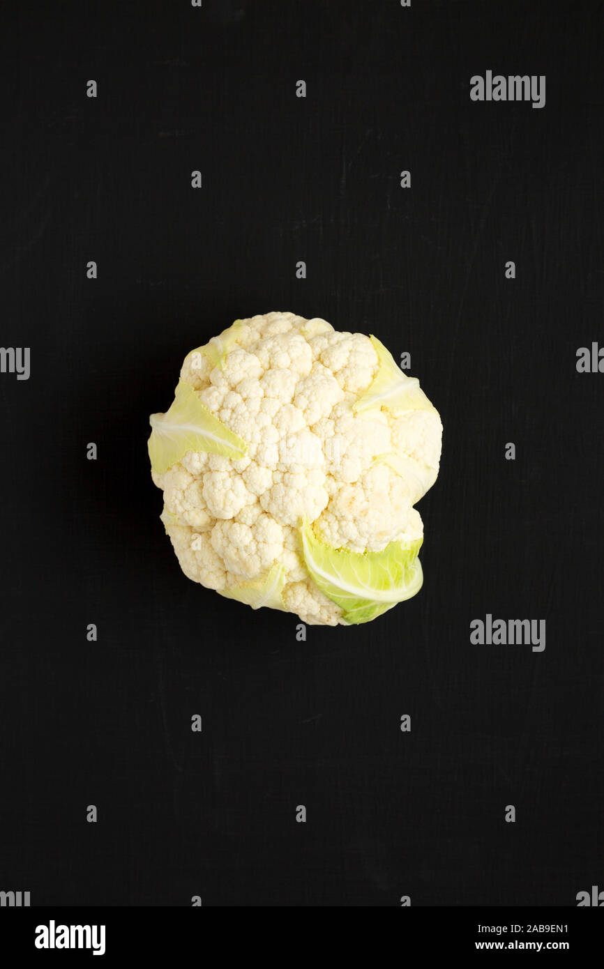 Top view, Raw Cauliflower Head on a black background. Flat lay ...
