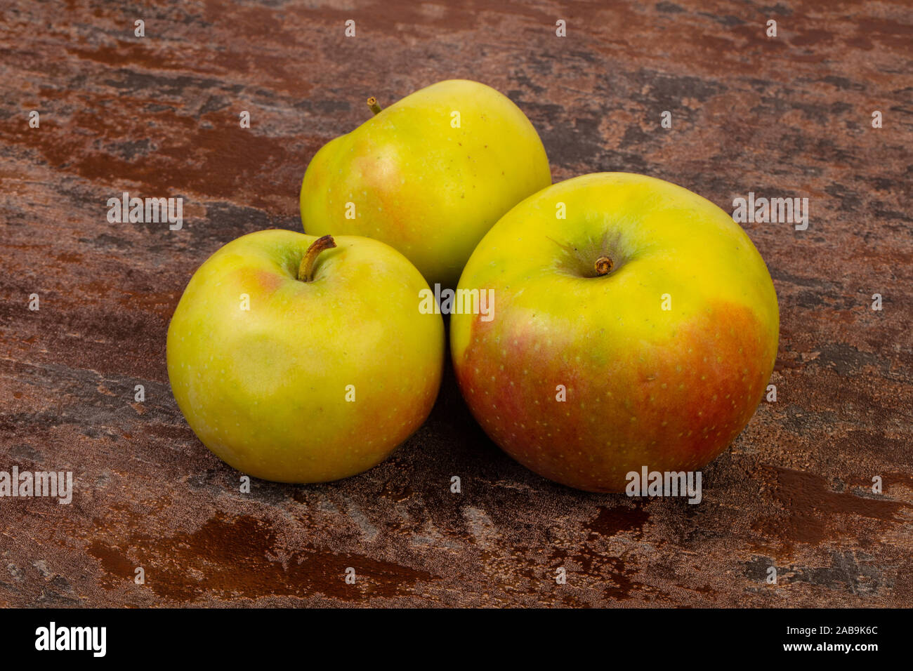 Ripe sweet apples over background Stock Photo - Alamy