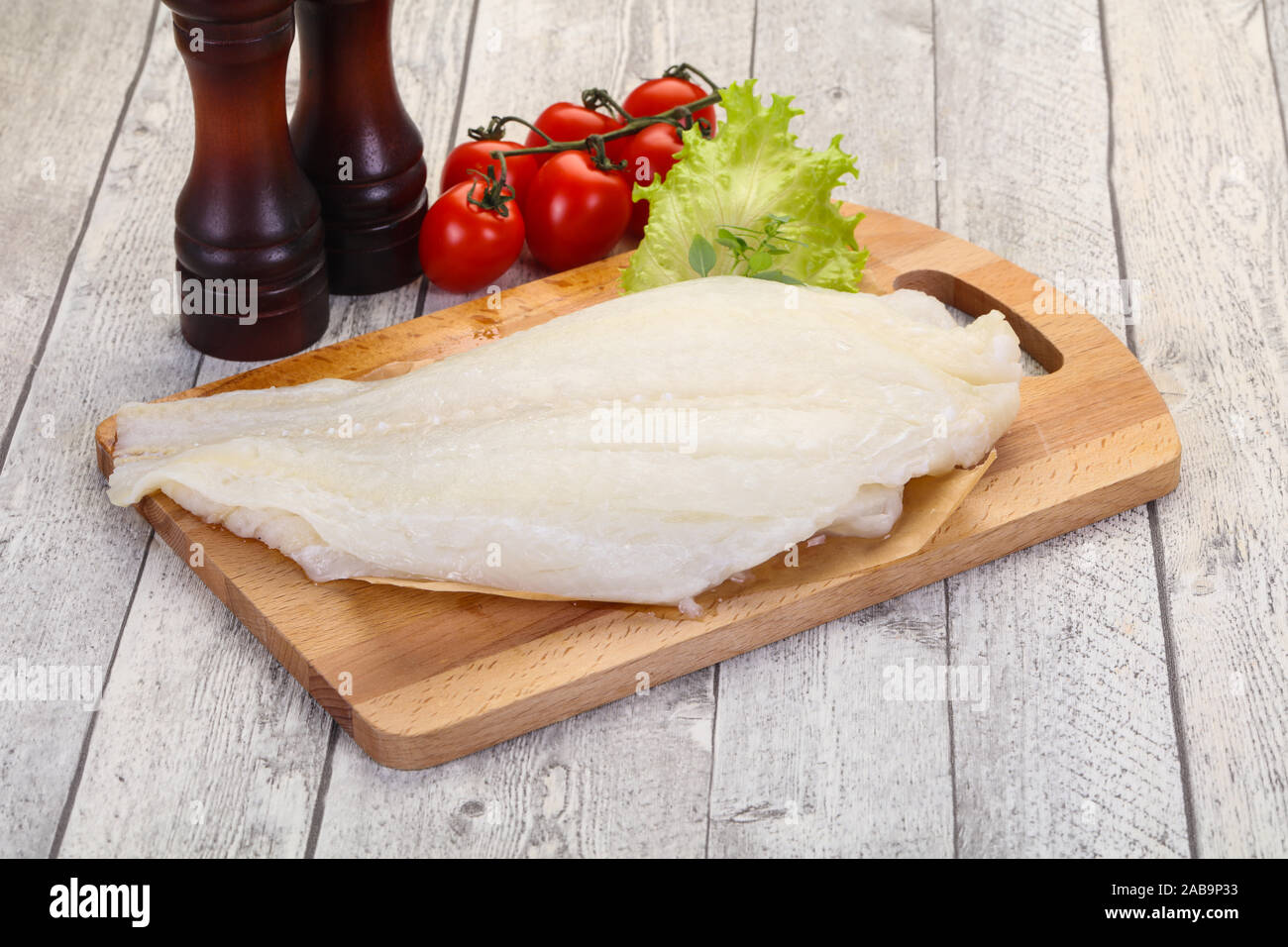 Raw halibut fillet ready for cooking Stock Photo - Alamy
