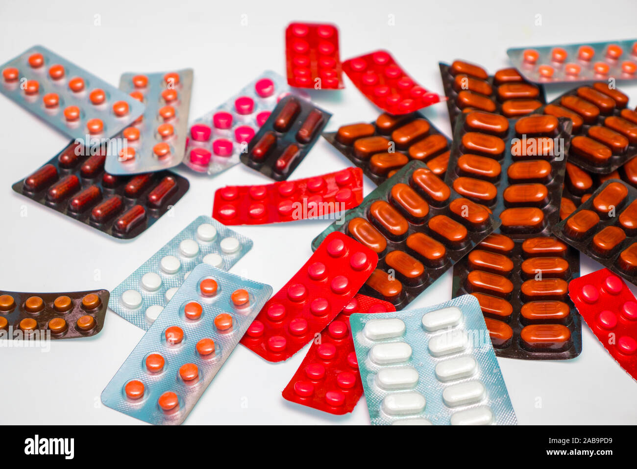 Different tablets, pills in foil blister packs, medications drugs on ...