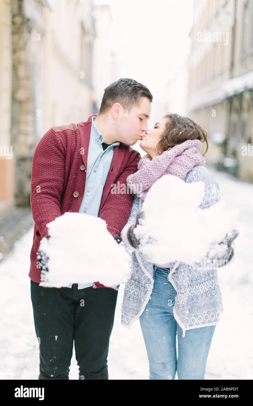 Happy adult woman holding snowballs hi-res stock photography and images ...